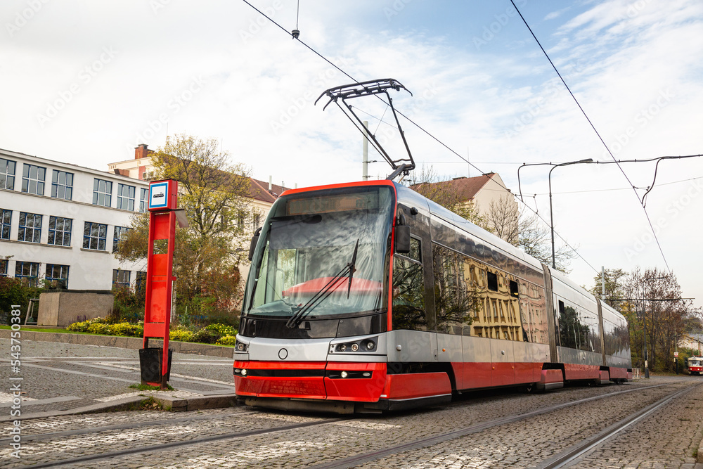 Modern Tram in old stree of Prague in a summer day, Czech Republic. The ...