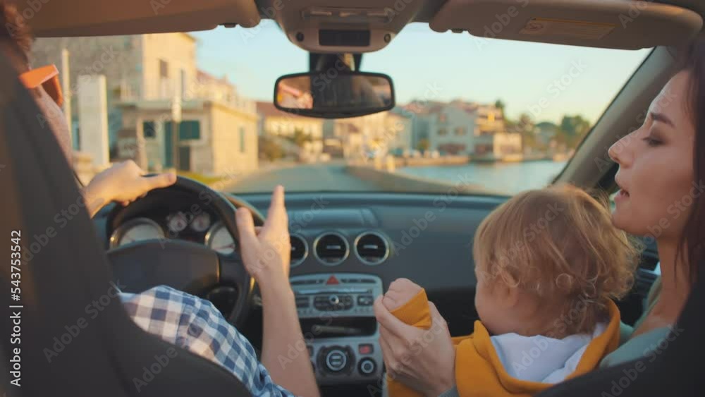 Dangerous driving. Careless family of mother, father driver and a baby ...