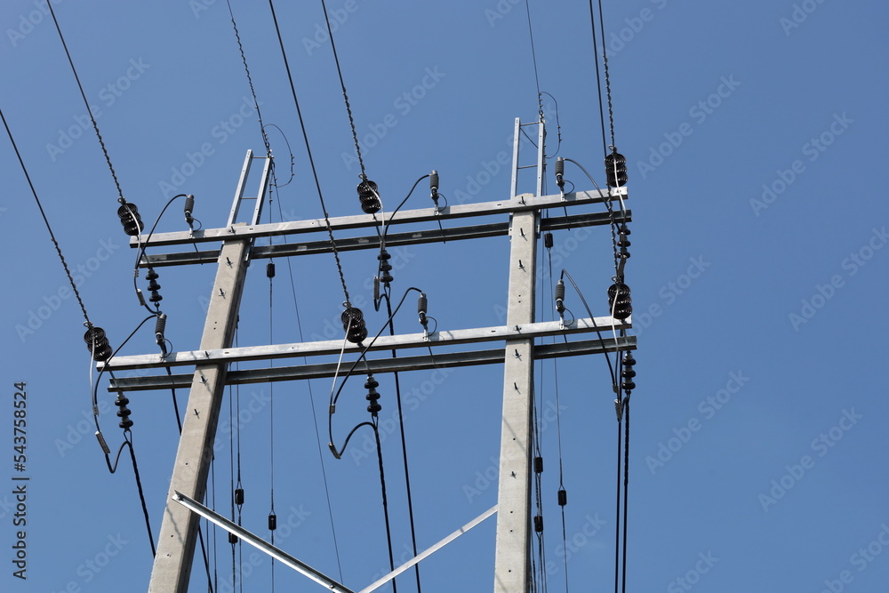 Twin towers with high voltage cables. A close-up of twin concrete ...