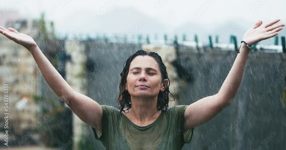 Caucasian Female standing in the rain. Inspired meditating woman 40's ...