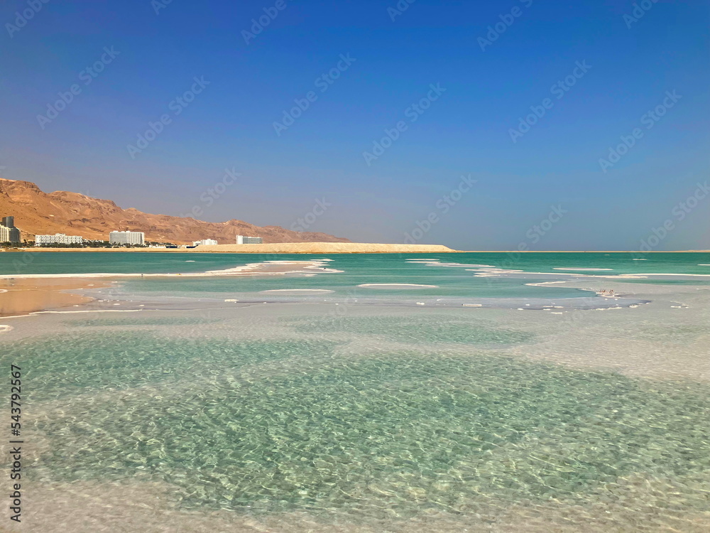 Ein Bokek resort on the Dead Sea in Israel. The majestic mountains of the Judean Desert, the ...