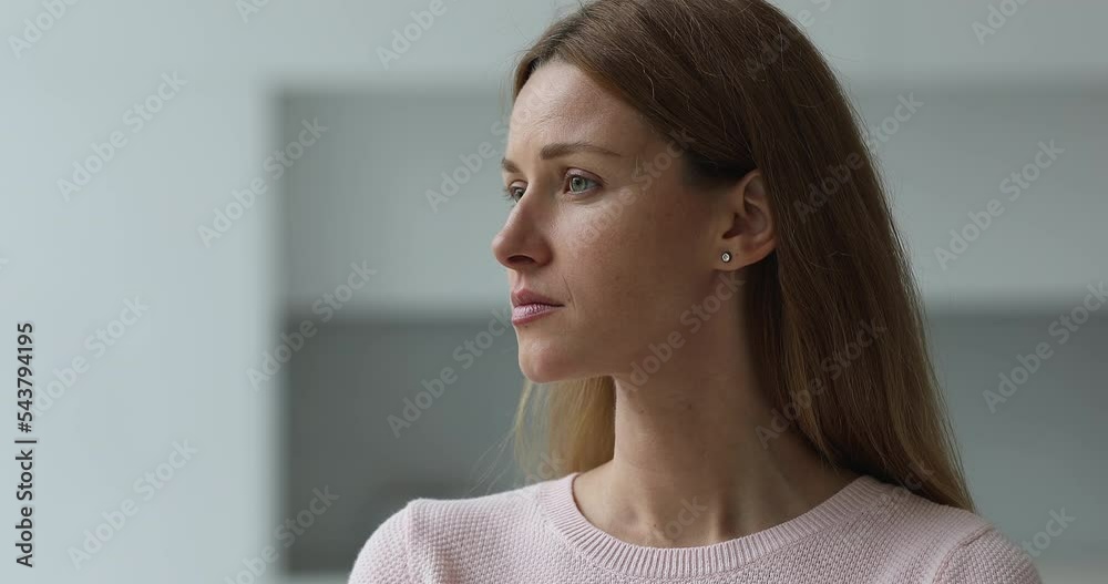 Thoughtful uncertain pretty young 30s woman with natural makeup looking ...
