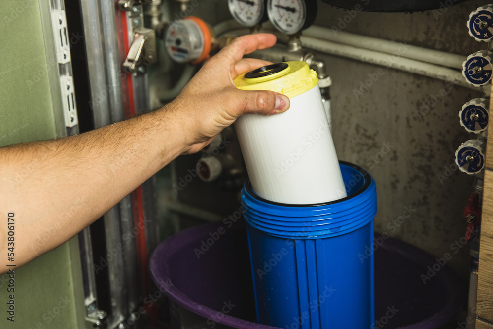 Replacing the filter element in the home water purification system ...