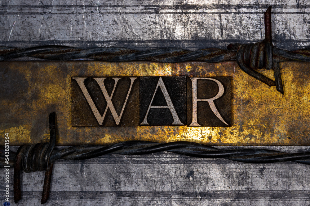 War text with barbed wire on grunge textured copper and gold background ...
