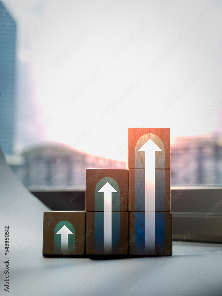 Rise up arrows on wooden blocks, 3d bar graph chart steps on building ...