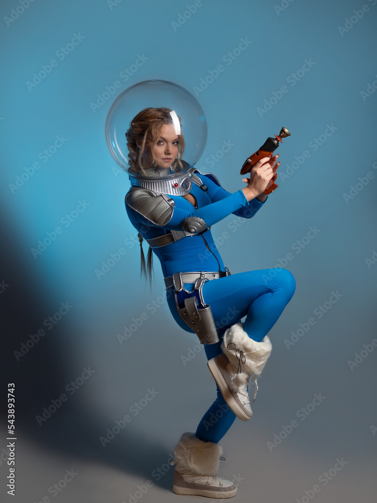 Fantastic astronaut costume in retrofuturism style. A young beautiful ...