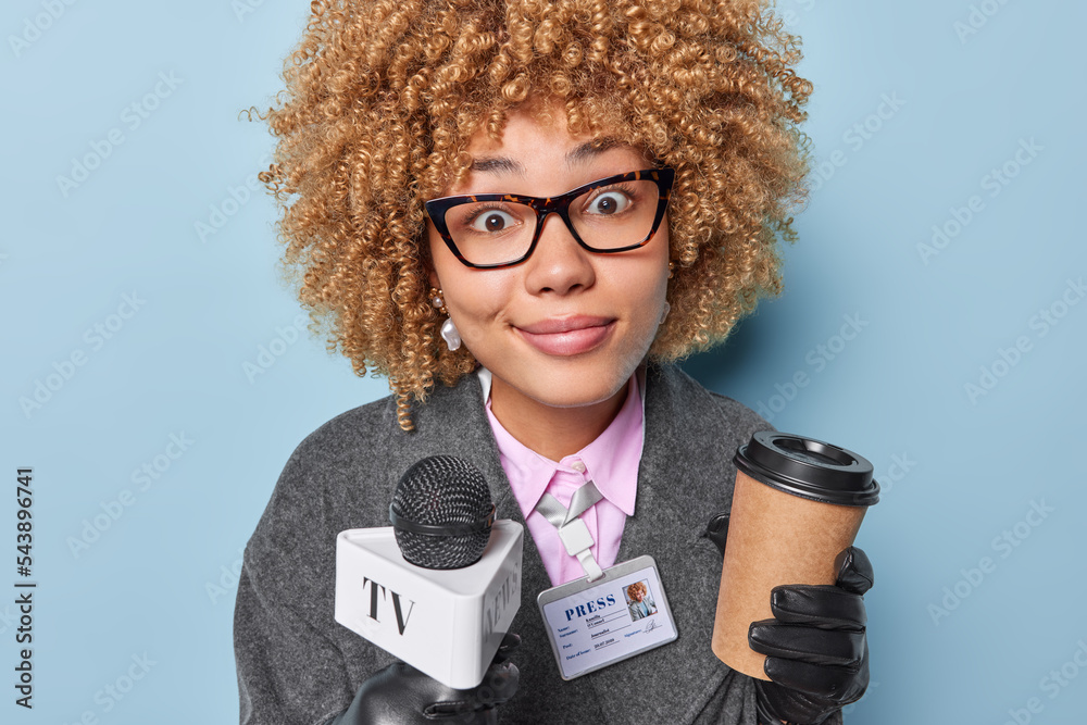 Journalism concept. Surprised curly haired professional woman TV ...
