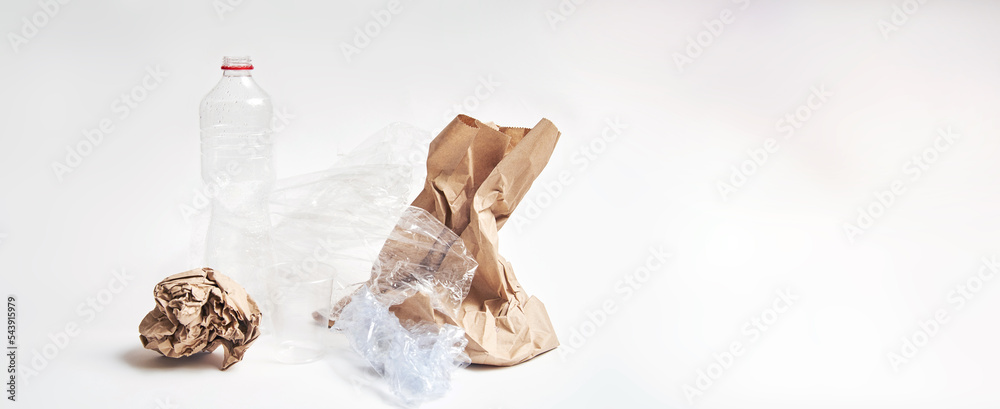 Paper and plastic waste garbage unsorted on a white background. Stock ...