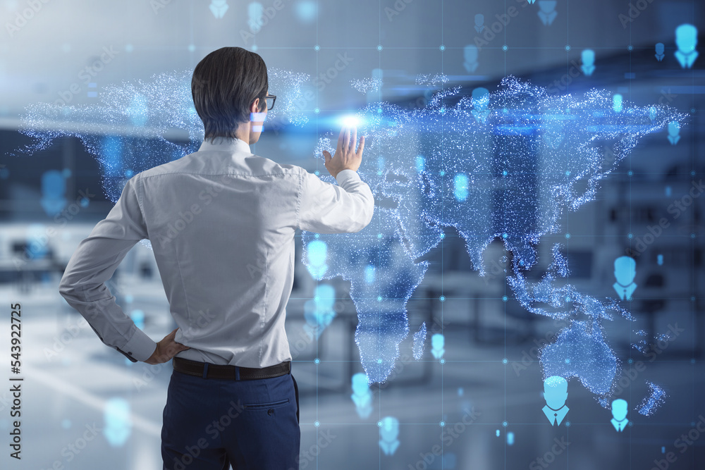 Attractive european businessman using abstract glowing map hologram on ...