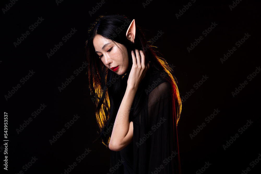 Fairy woman elf queen in black fantasy rope long dress cast spell ...