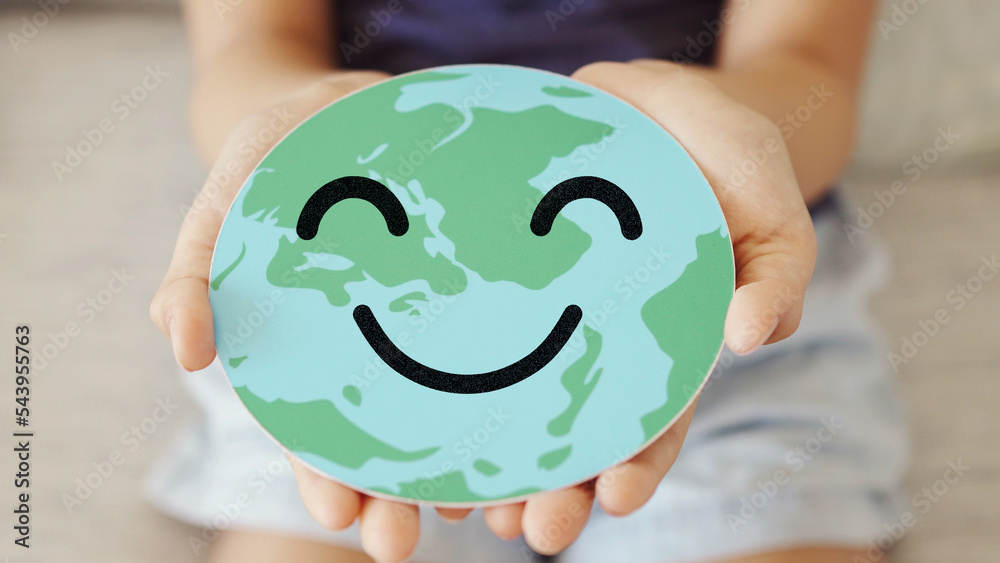 Hands holding earth with smile face, save planet, earth day ...