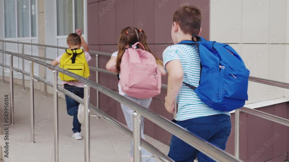 little children run school lesson. group children with school backpack ...