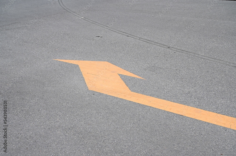 yellow arrow on cement road, construction background Stock Photo ...