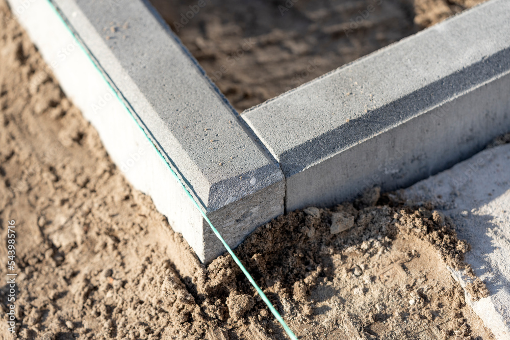 curb Close-up on the installation and installation of a concrete curb ...