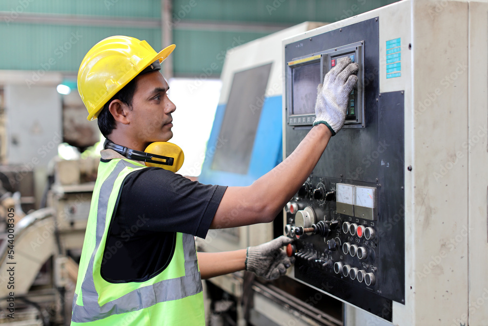 Technician engineer man in protective uniform standing and using ...