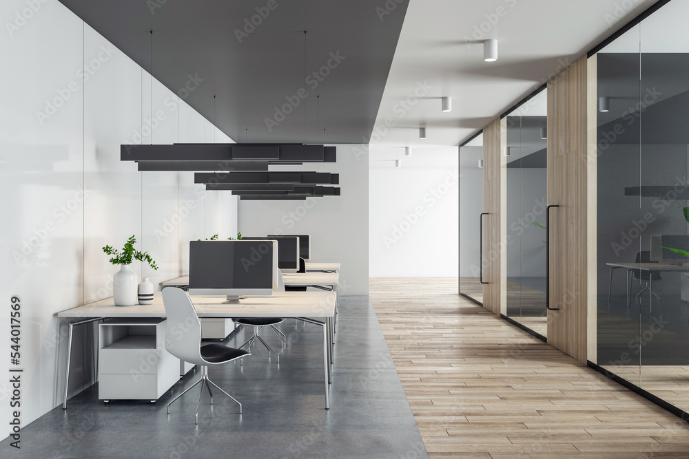 Side view on modern computers on light wooden workspace tables with ...