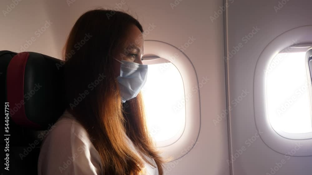 Passenger woman wear face mask during flight, new normal during and ...