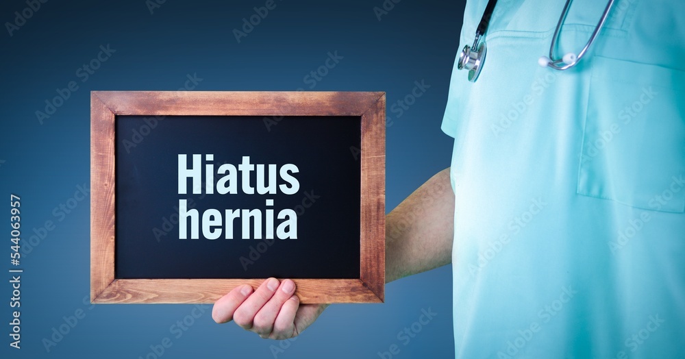 Hiatus hernia (hiatal hernia). Doctor shows sign/board with wooden ...