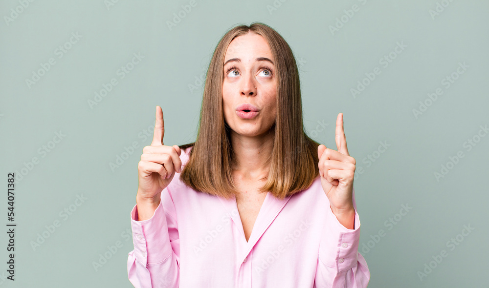 feeling awed and open mouthed pointing upwards with a shocked and ...