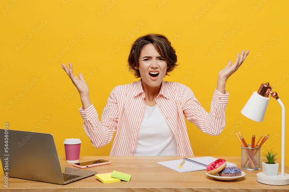 Young shout sad mad employee business woman wear casual shirt sit work ...