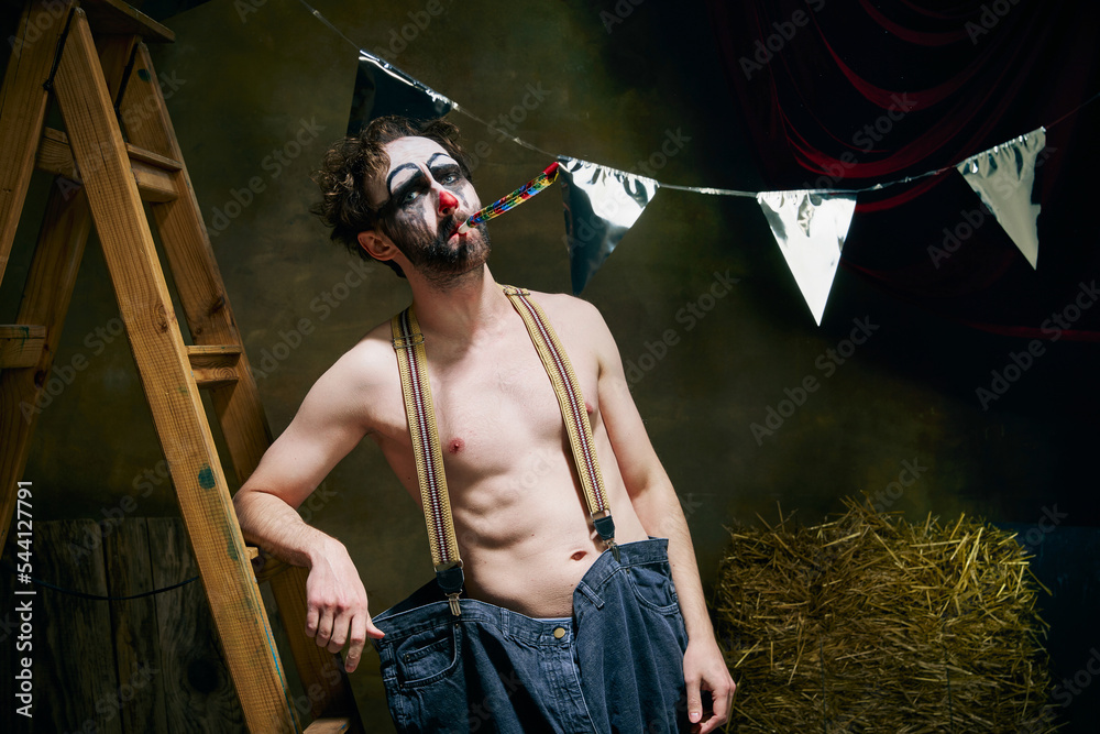 Sad male clown is sad, going through a personal tragedy, despair in the ...