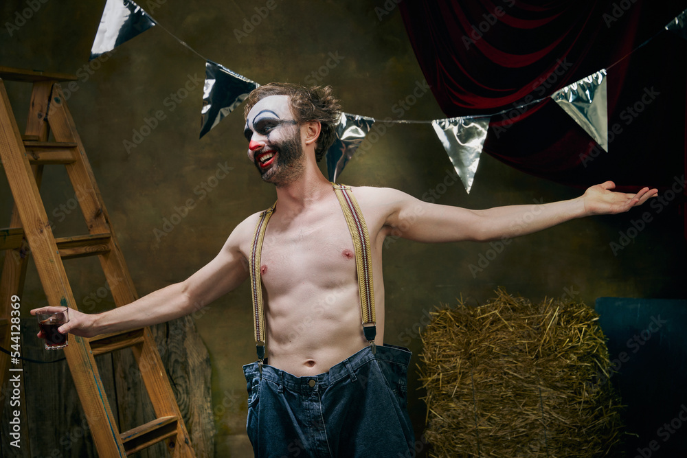 Sad male clown is sad, going through a personal tragedy, despair in the ...
