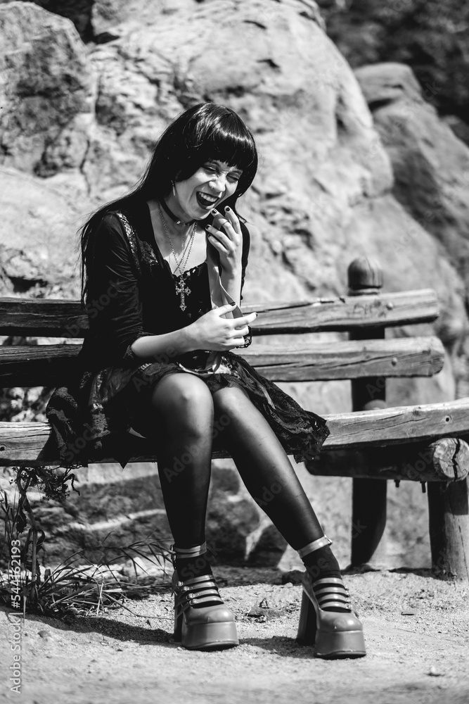 Young, sexy and vampiric hispanic goth girl with black dress and big ...