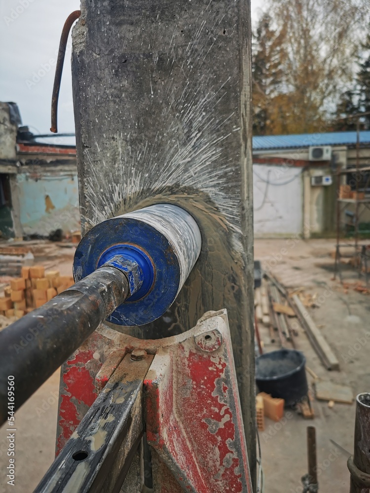 Hole cutting machine. Drilling concrete with an industrial drilling ...