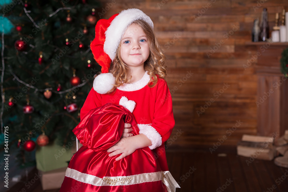 Beautiful little blonde baby girl, has happy fun cheerful smiling face ...