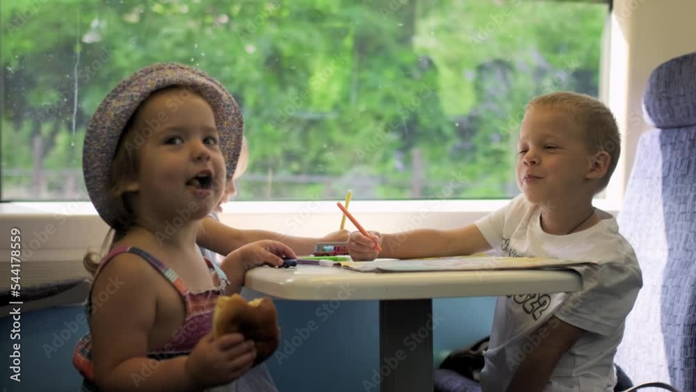 Three little Happy Children are Traveling by train. Small Tourists on ...