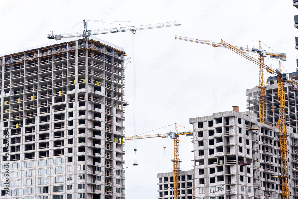 Crane tower at the construction site of a multi-storey residential ...