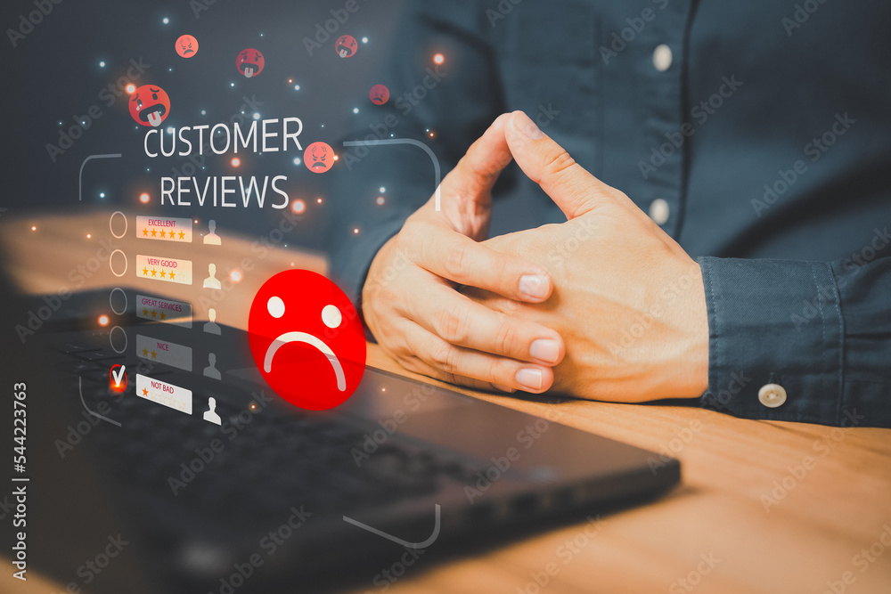 Unhappy man customer with sad emotion face on laptop. Bad review and ...