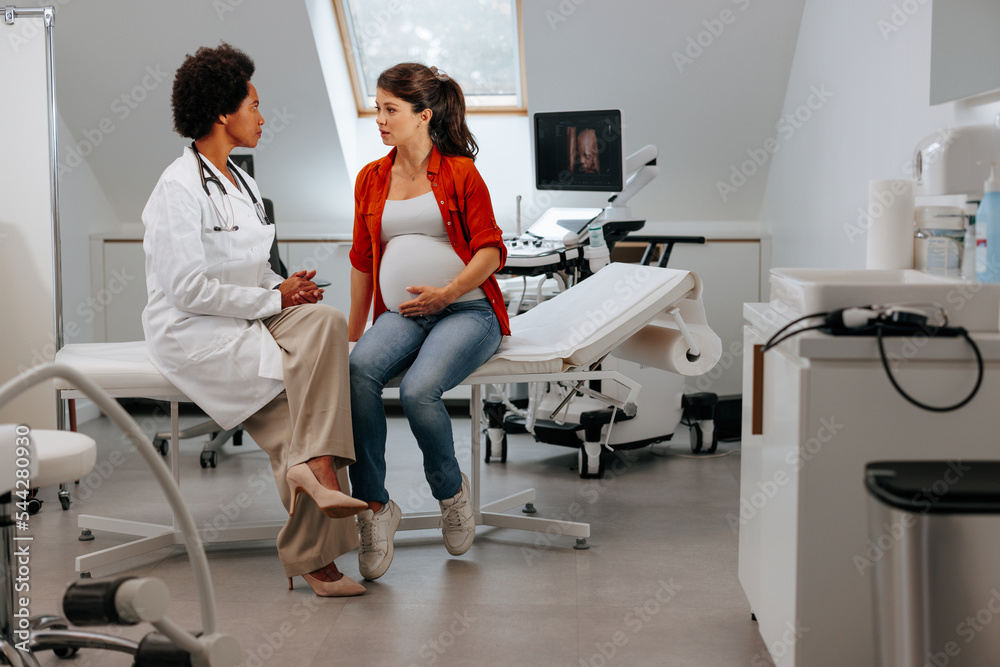 Pregnant woman in maternity clinic for consultation. Stock Photo ...
