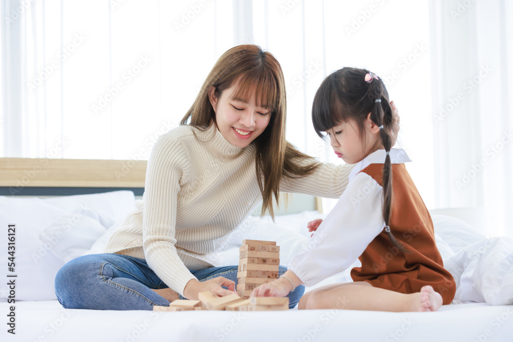Asian young teenage female mother nanny babysitter in casual sweater ...