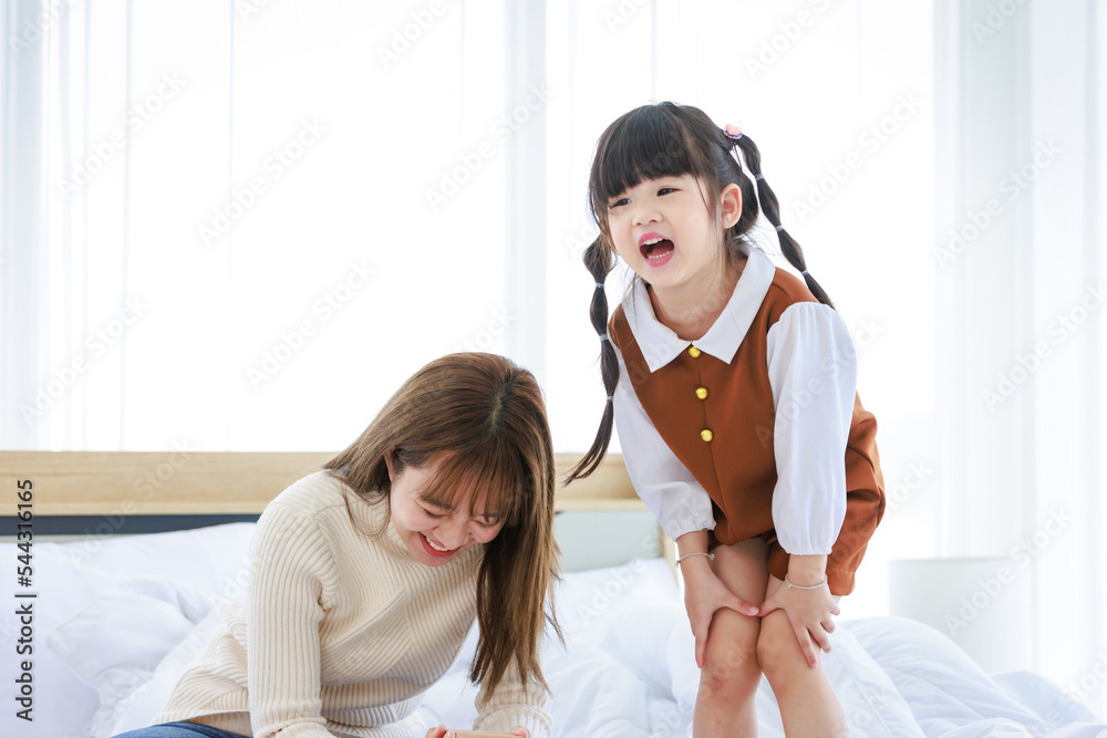 Asian young teenage female mother nanny babysitter in casual sweater ...