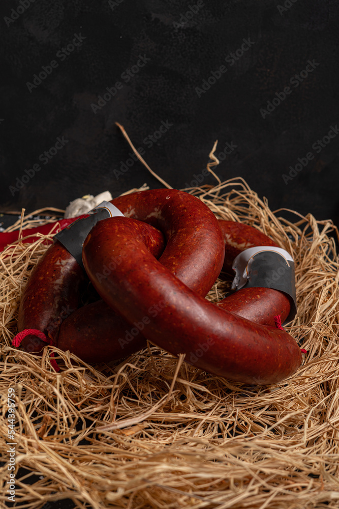 Sucuk meat sausage, Sujuk dry spicy sausage. Black background. Top view ...