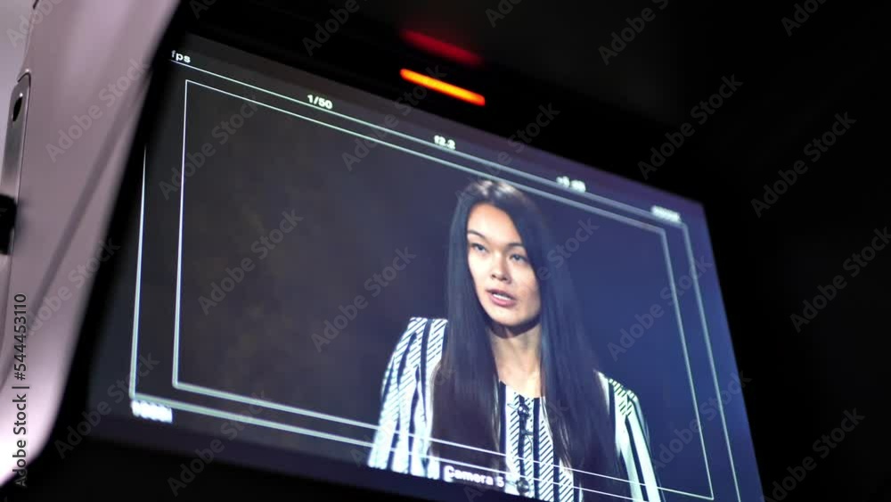 live broadcast on television. in the frame a pretty young presenter of ...