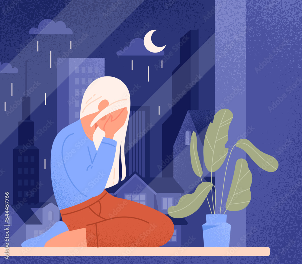 Sad girl at window. Woman on background of night city sits on knees ...