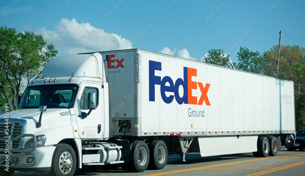 FedEx truck on the road making package deliveries. Shakopee Minnesota ...
