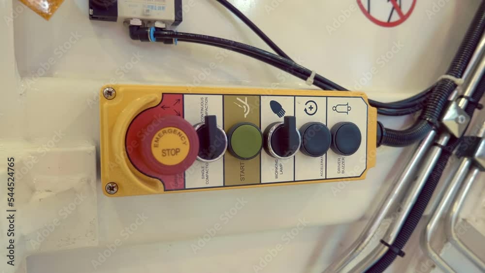 Yellow control panel on board the white truck for the operation of ...