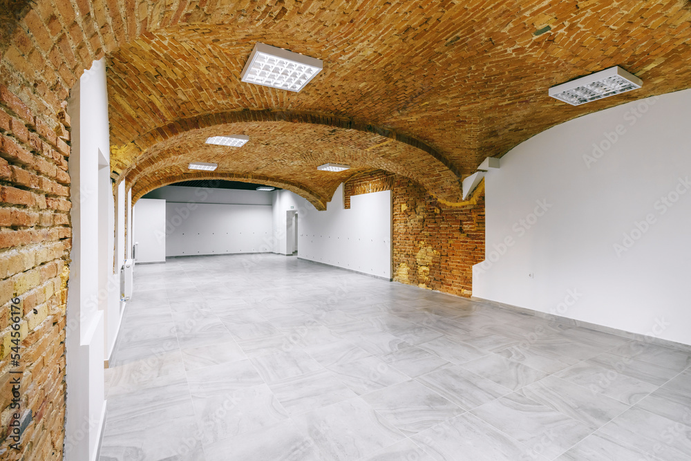 Empty rooms in modern and old style with a vaulted ceiling made of clay ...