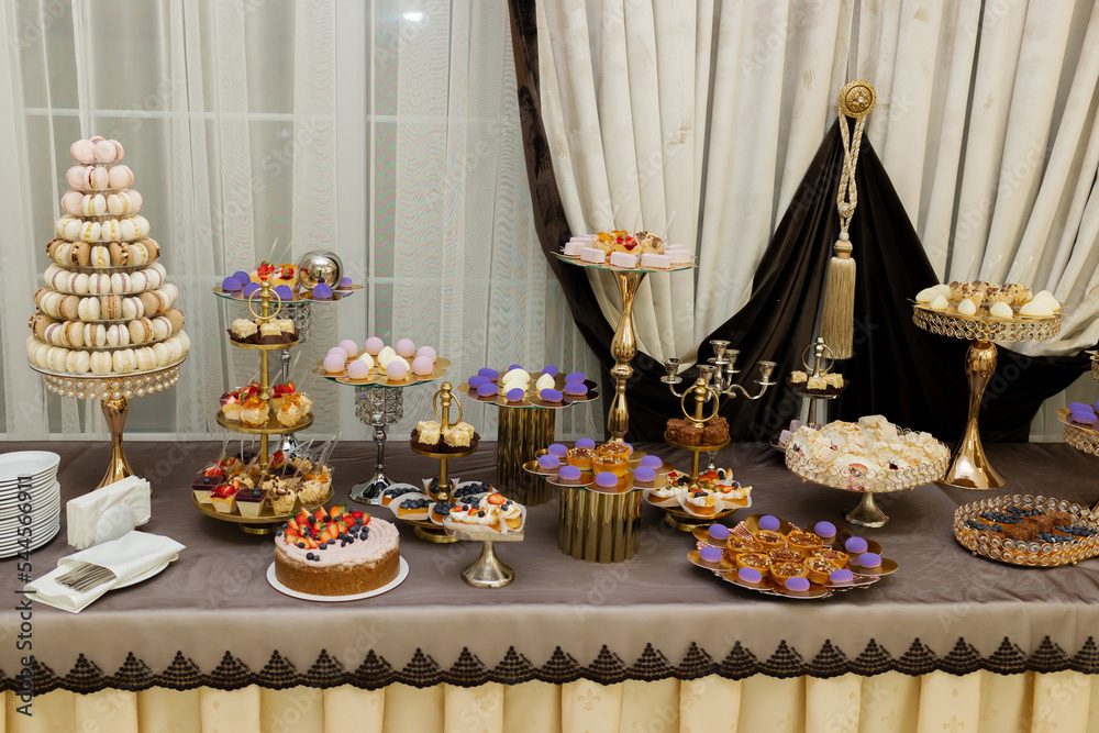 Table with cakes, sweets, candy, buffet. Dessert table for a party ...