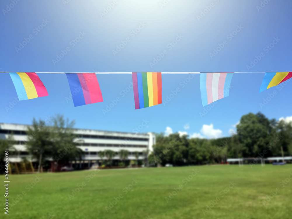 gbtq+ flags were hung on wire against bluesky on sunny day, soft and ...
