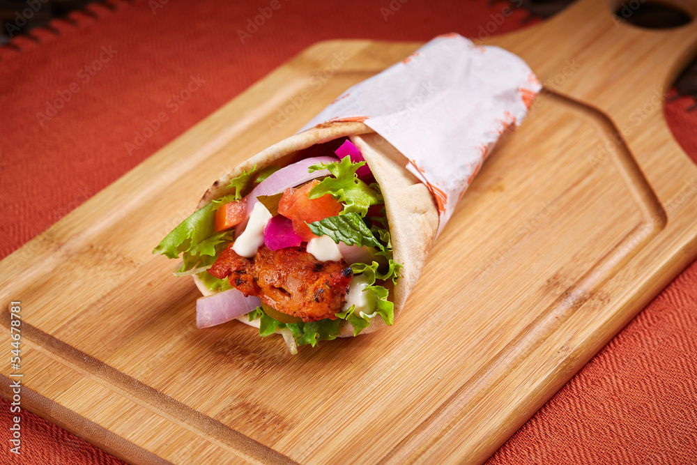 Shish Tawook Shawarma wrap or Sheesh Tawook Sandwich served in dish ...