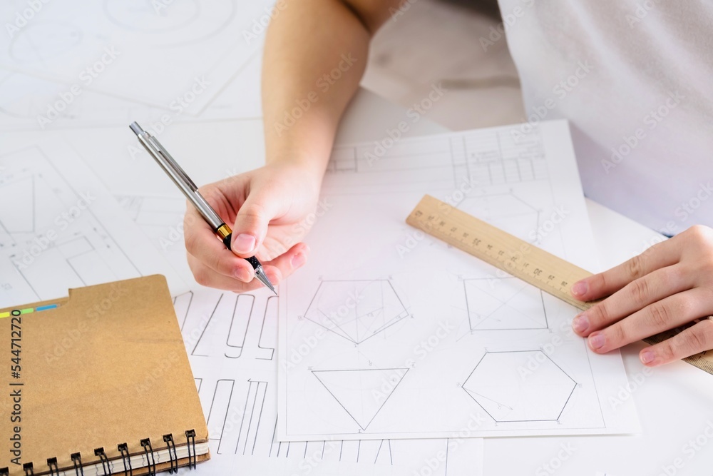 A young woman does her mechanical drawing homework. Mechanical drawing ...