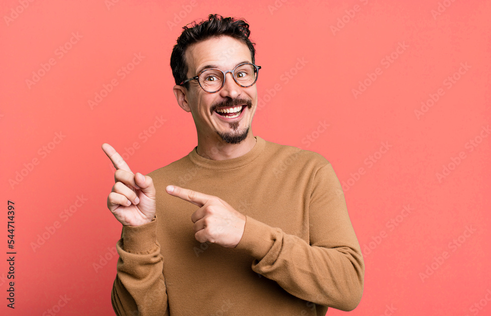 feeling joyful and surprised, smiling with a shocked expression and ...