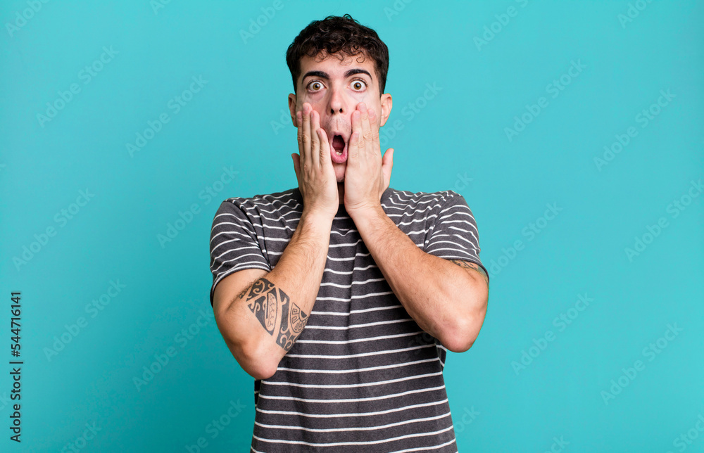 feeling shocked and scared, looking terrified with open mouth and hands ...