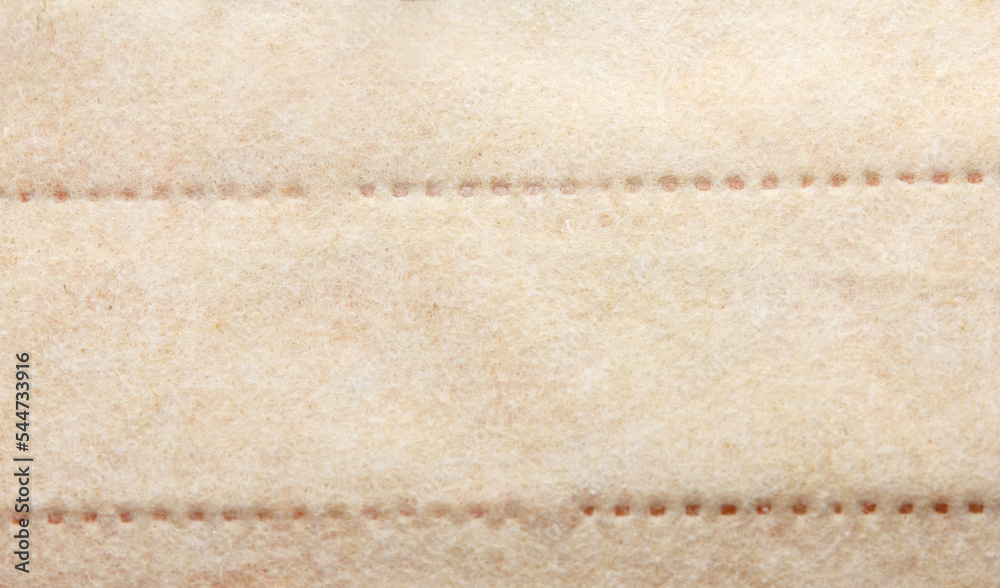 Surface of a warm two-sided electro sheet, laid out on the bed, looks ...