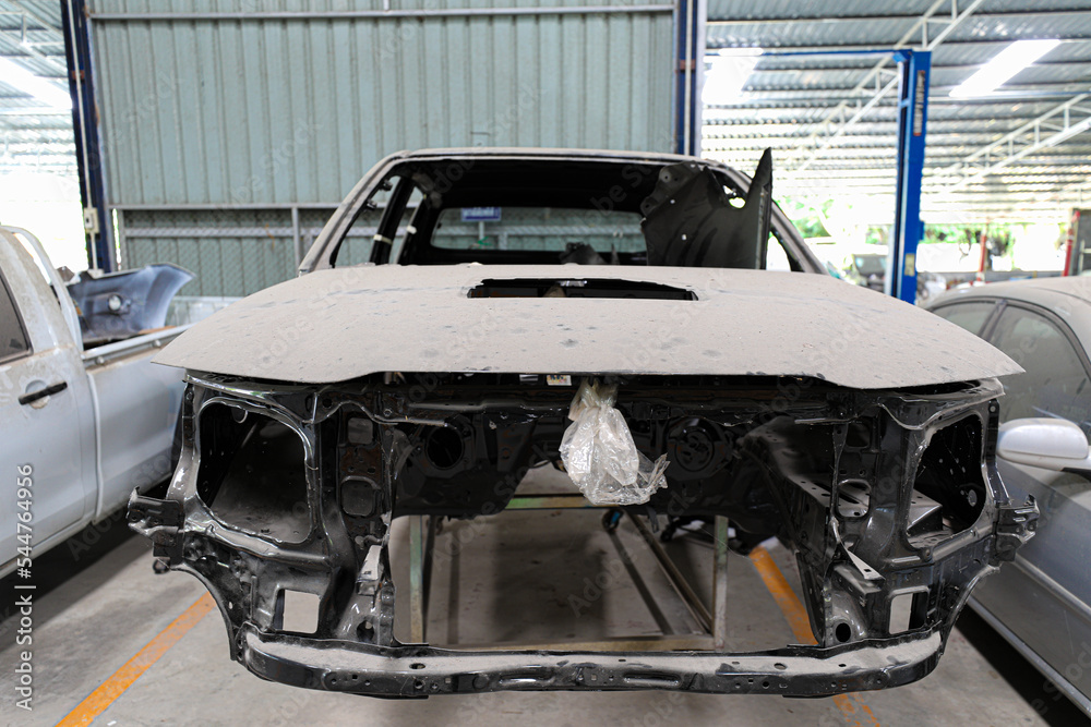 Standard auto repair shop is repairing and repainting the car after the ...