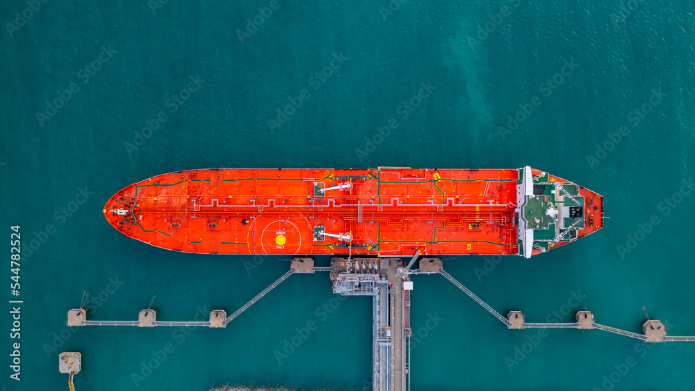 Aerial top view industrial crude oil fuel tanker ship at terminal ...